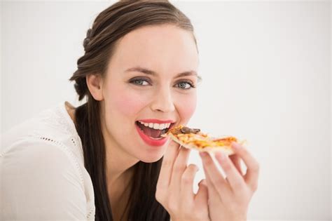 Premium Photo Pretty Brunette Eating Slice Of Pizza