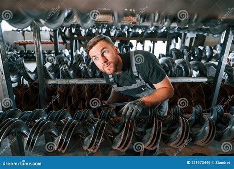 Checking Number Of Parts Man In Uniform Is In Workstation Developing Details Of Agriculture