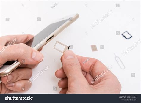 Removing Sim Card Out Smartphone Replacing Stock Photo 2042533184 Shutterstock