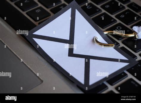 Closeup Image Of Mail With Hook On Top Of Keyboard Phishing Email Malware And Cyber Security