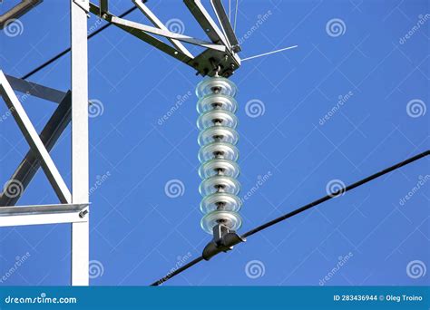 High Voltage Tower With Electrical Voltage Wires Isolates Close Up Against The Background Of