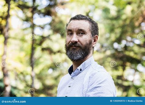Cute Smiling Man With A Grizzled Beard Stock Photo Image Of Crossed