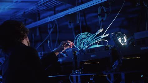 Man Analysing Cables In A Data Center Technology Stock Footage Ft Technology And Adult Envato