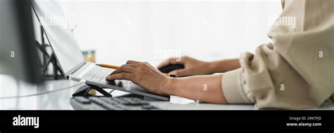 Developer Programmer Using Mouse And Typing Code On Laptop While Programming To Developing