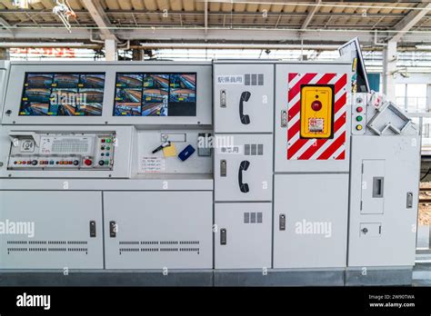Japanese Shinkansen Bullet Train Control Station On The Platform With Overhead Video Feeds