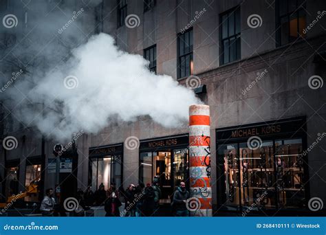 Closeup Of A Sewer With Steam Coming Out In The Streets Of Manhattan