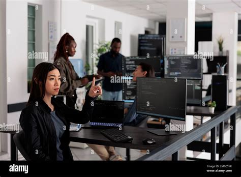 Asian Web Developer Working With Hologram And Coding Language In