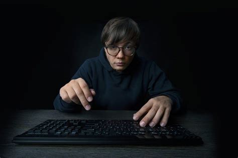 Man Programmer With Keyboard Banda