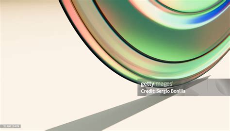Abstract Concentric Circles With A Gradient Of Multiple Colors Against A Beige Background