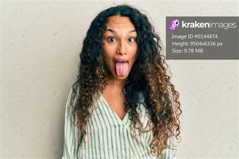 Young Latin Woman Wearing Casual Clothes Sticking Tongue Out Happy With