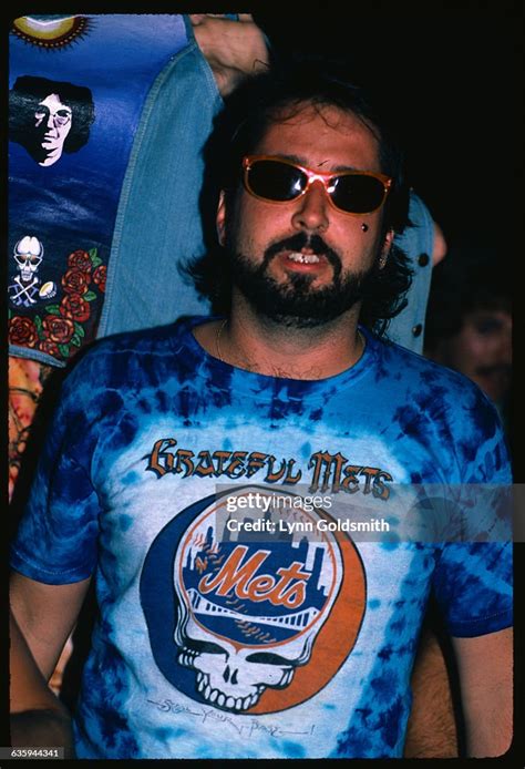 A Deadhead Wears A T Shirt Which Mixes Logos Of Of The Grateful Dead