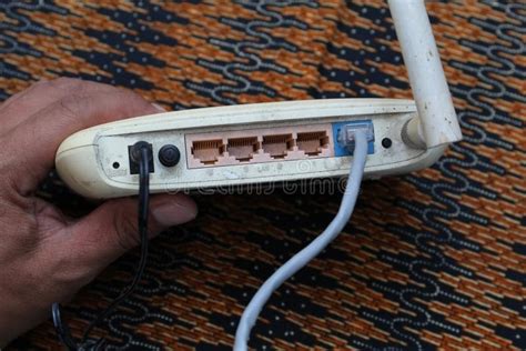 Close Up Lan Network Connected To Ethernet RJ Port To Wireless Modem Router Network Hub Stock