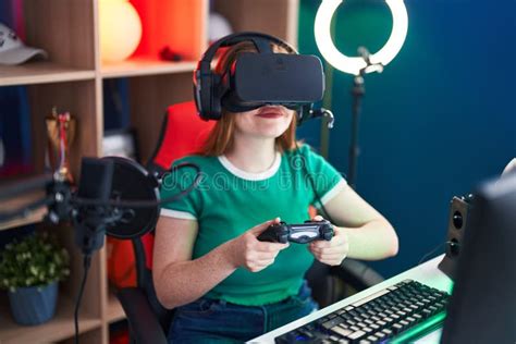 Young Redhead Woman Streamer Playing Video Game Using Virtual Reality