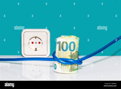 White European Plug Socket Tied Up With An Electrical Plug On Blue Background Concept Of