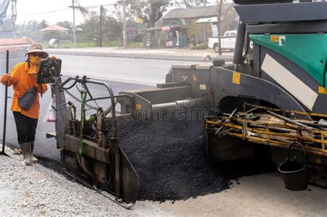 Machines Are Crushing The Asphalt After Pouring To Make A Road For Cars Stock Image Image Of