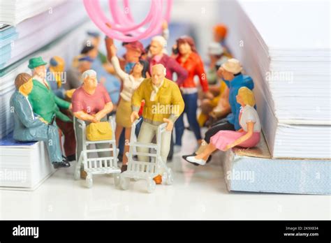 Miniature Toy Of Couple Of Senior Citizen On A Public Transport Concept