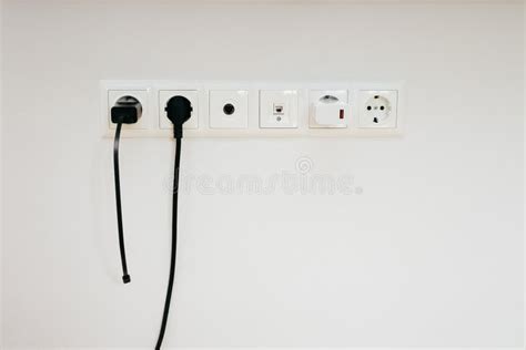 An Electrical Socket In The Wall In The Apartment Of The House Black