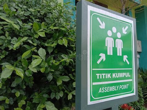 Assembly Point Signs Are Written In English And Indonesian Stock Photo Image Of Communication