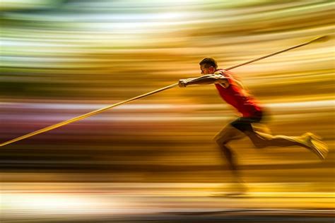 Javelin Thrower Captured Midthrow In Action Premium Ai Generated Image