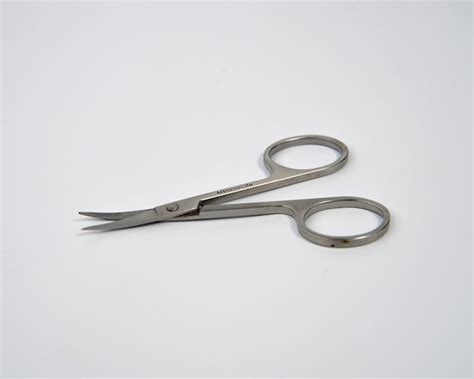 Premium Photo Small Scissors Made Of Stainless Material On A White Background