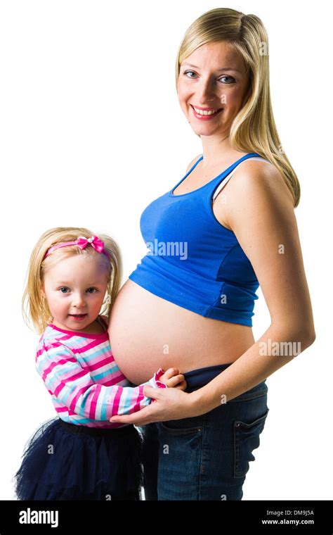 Pregnant Woman With Her Daughter Isolated On White Background Stock