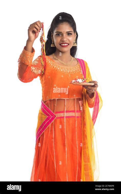 Beautiful Indian Girl Showing Rakhi With Pooja Thali On Occasion Of Raksha Bandhan Sister Tie