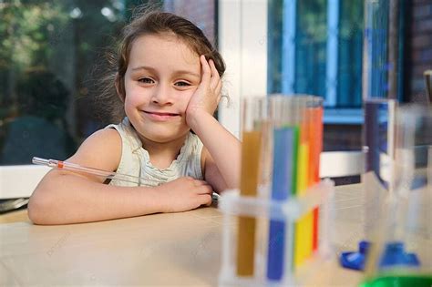 Cute Girl Experiments With Test Tubes And Smiles Photo Background And Picture For Free Download