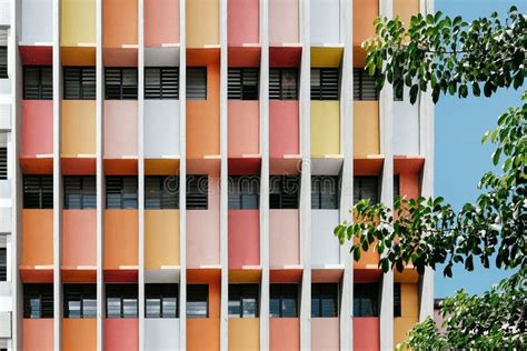 Facade Of A Multicolored Building With Narrow Stripes And Windows For Backgrounds Stock Image