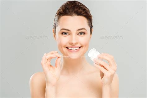 Cheerful Naked Woman Holding Dental Floss And Smiling Isolated On Grey Stock Photo By