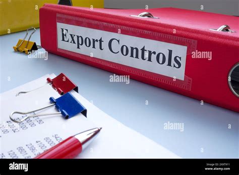 Accounting Documents And A Folder Labeled Export Controls Financial Regulation And Sanctions