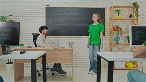 Student And Instructor Discuss Python Code In Modern Classroom Stock Video Video Of Student And Instructor Discuss Python Code In Modern Classroom Stock Video Video Of