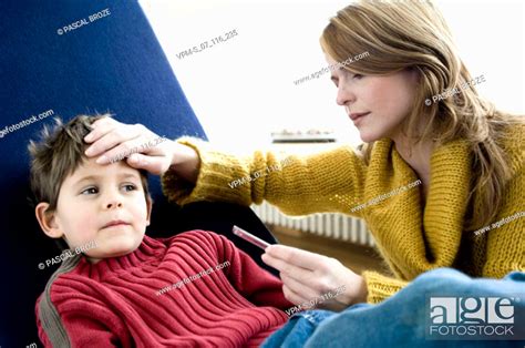 Mother Taking Her Son S Temperature Stock Photo Picture And Rights Managed Image Pic VPM S