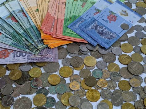 Premium Photo Malaysian Ringgit And Coins On Isolated Background