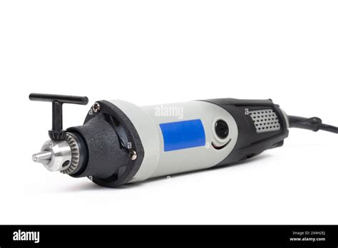 Compact Electric Drill Featuring A Key Inserted Into The Chuck Bit