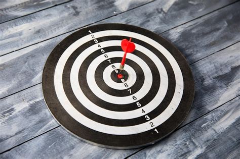 Premium Photo Red Dart Arrow Hitting In The Target Center