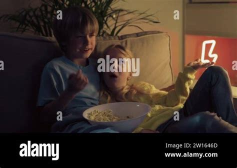 Brother And Sister Watching Tv And Talking Brother Hugged His Younger Sister Stock Video