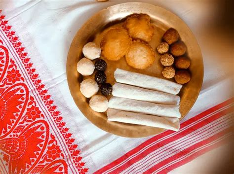 Assamese Traditional Food Items Pitha Laddu Doi Sira Assamese Gamosa