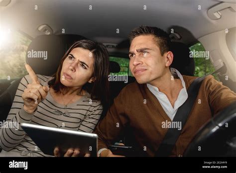 Caucasian Couple Tryng To Find A Location With GPS Tracker On The Tablet Stock Photo Alamy