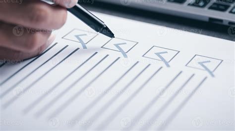 Human Hand Check Mark On Papercheck Concept Through Checkboxes