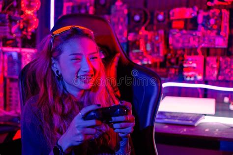 Gamer Using Joystick Controller For Virtual Tournament Plays Online Video Game Stock Photo