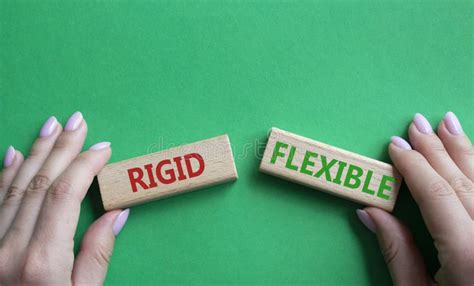 Rigid Or Flexible Symbol Concept Word Rigid Or Flexible On Wooden Blocks Businessman Hand