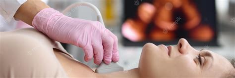 Premium Photo Doctor Making Ultrasound Of Thyroid Gland To Woman