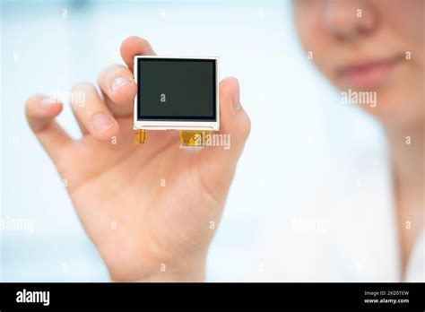 Girl Holding A Small OLED Display Stock Photo Alamy