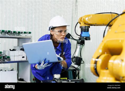 Female Automation Machine Engineer Student Study And Inspection Control Robot Arm Machine In