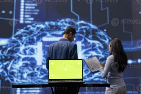 Focus On Green Screen Laptop Used By Teamworking Ai Technicians In