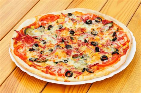 Pizza With Pepperoni Black Olives And Corn Stock Image Image Of