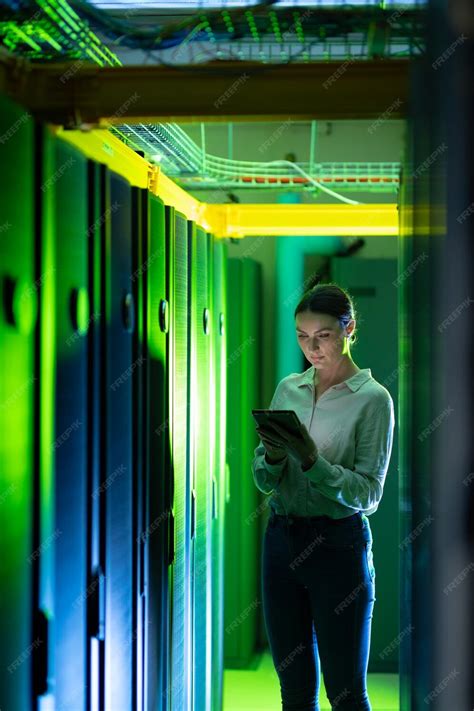 premium photo caucasian female engineer using digital tablet while