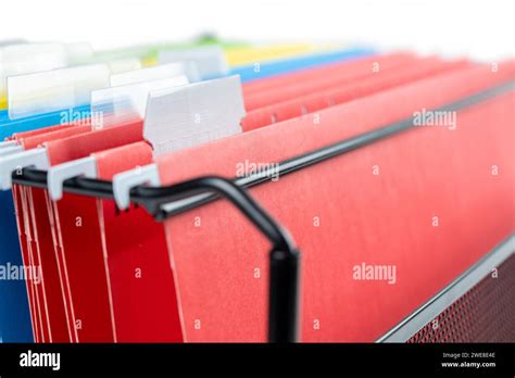 Closeup View Of The Colorful Hanging File Folder On The File Organizer Isolated Over A White
