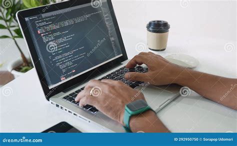 Programmer Man Writing Program Code Sitting At Workplace In Office