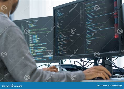 Asian Prompt Engineer Developer Coding App With Software Data Sitting In Front Of Computer